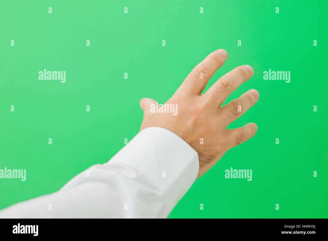 Open hand in shirt on a green screen Stock Photo - Alamy