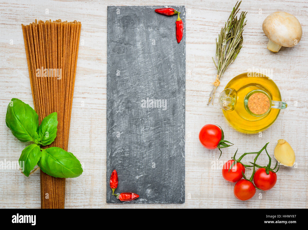 Dark Brown Italian Spaghetti with copy space and cooking ingredients ...