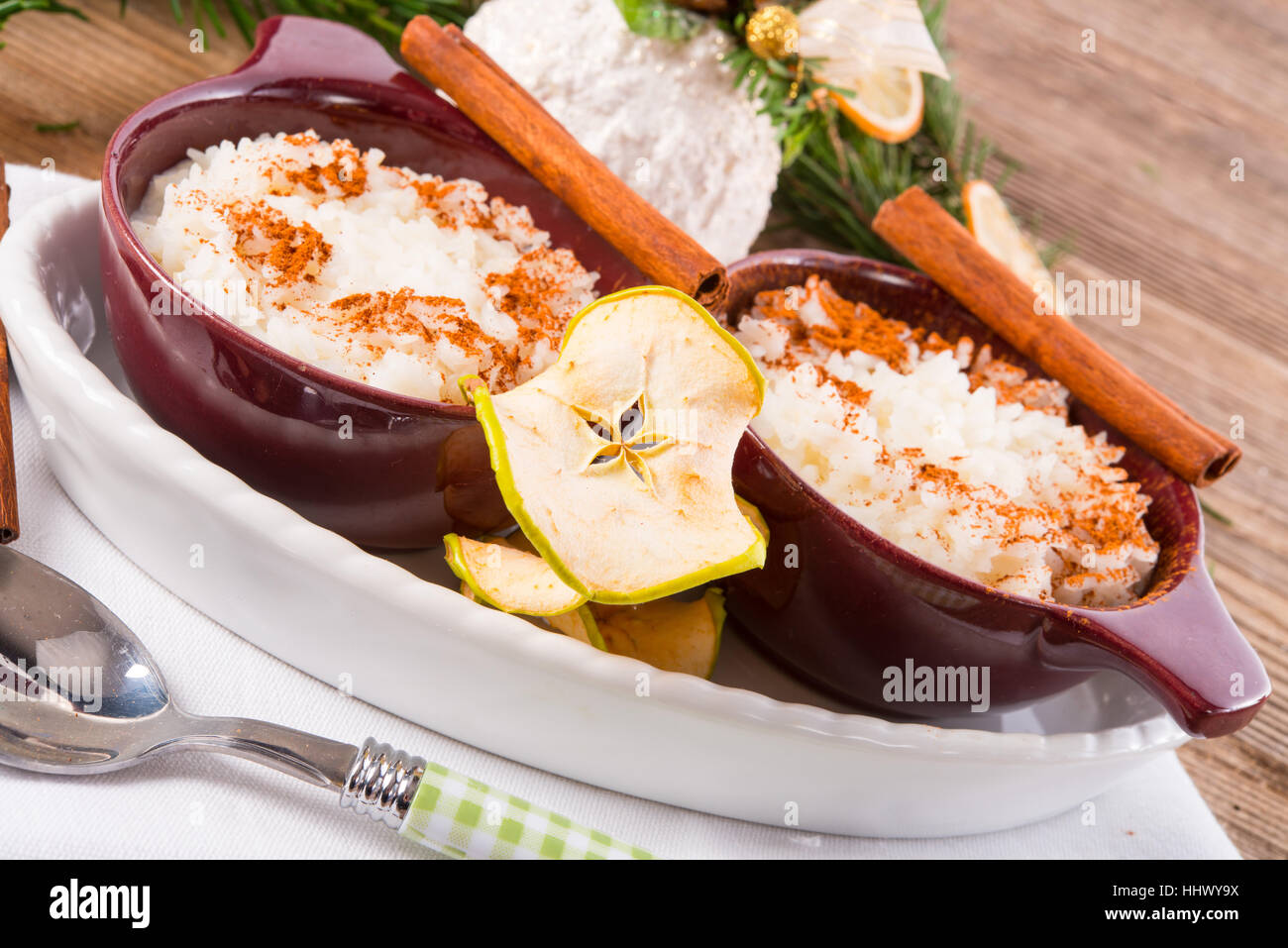 milk rice with cinnamon and applesauce Stock Photo - Alamy