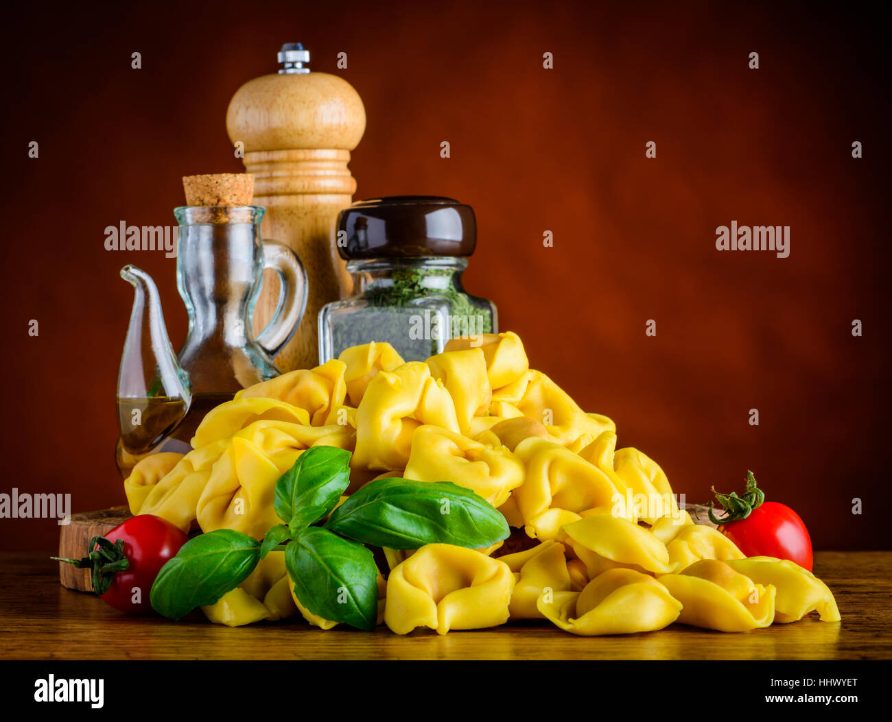 Yellow Italian Tortellini Pasta with Food Seasonings and Spices Stock ...