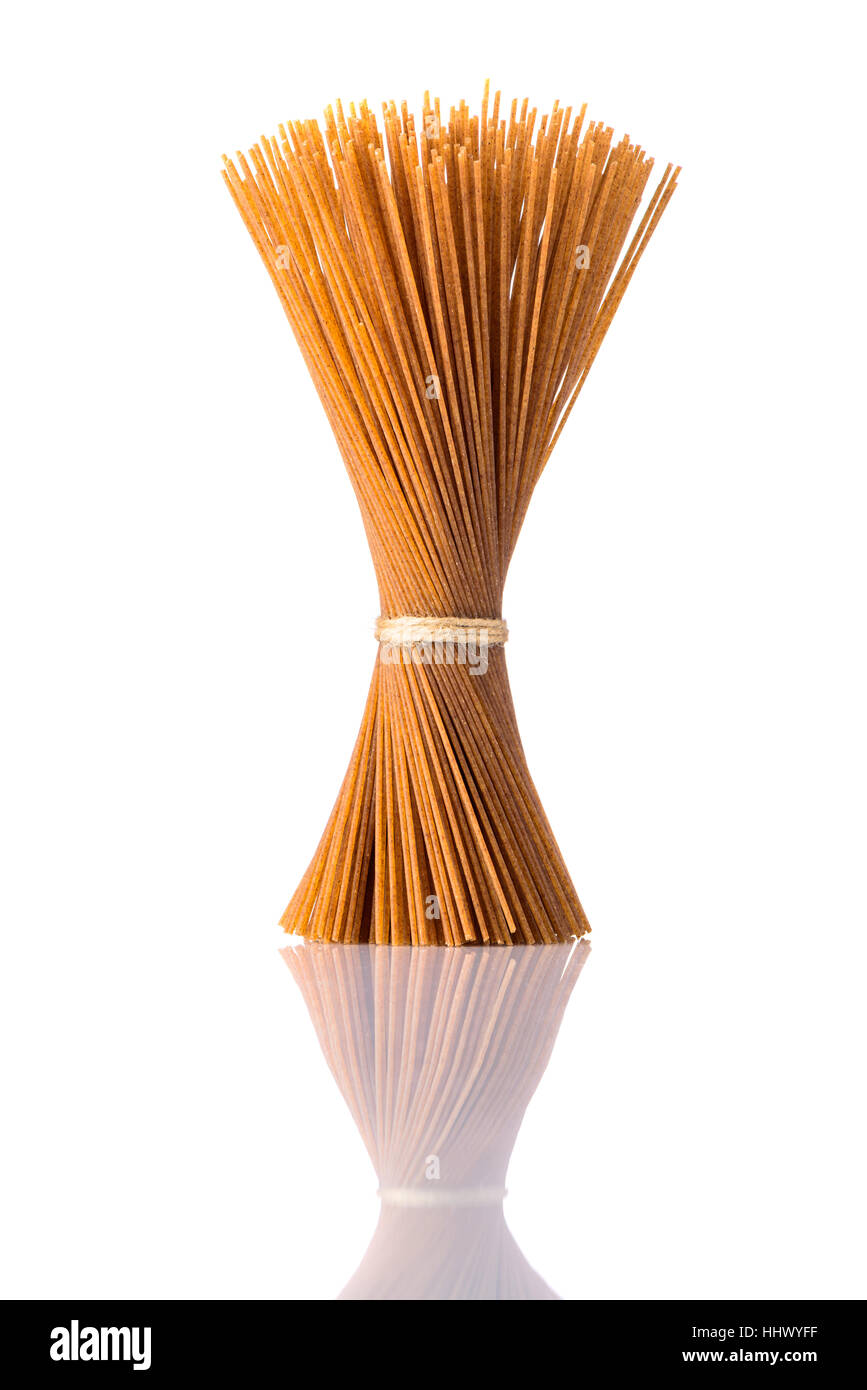 Bundle of Brown Whole-Wheat Spaghetti pasta isolated on white ...