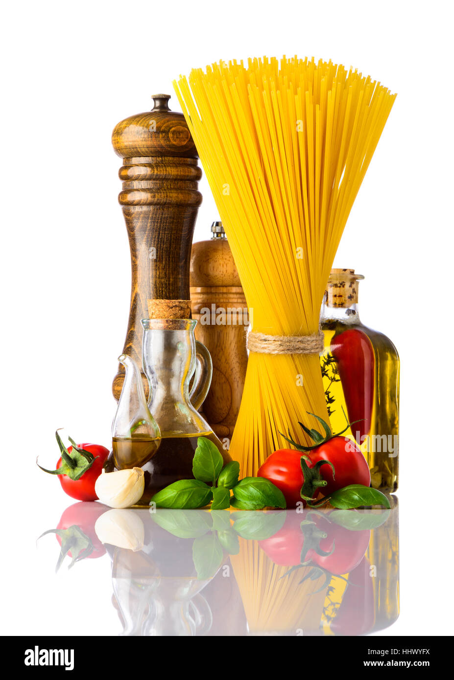 Yellow Spaghetti with seasoning, vegetables and spices on white ...