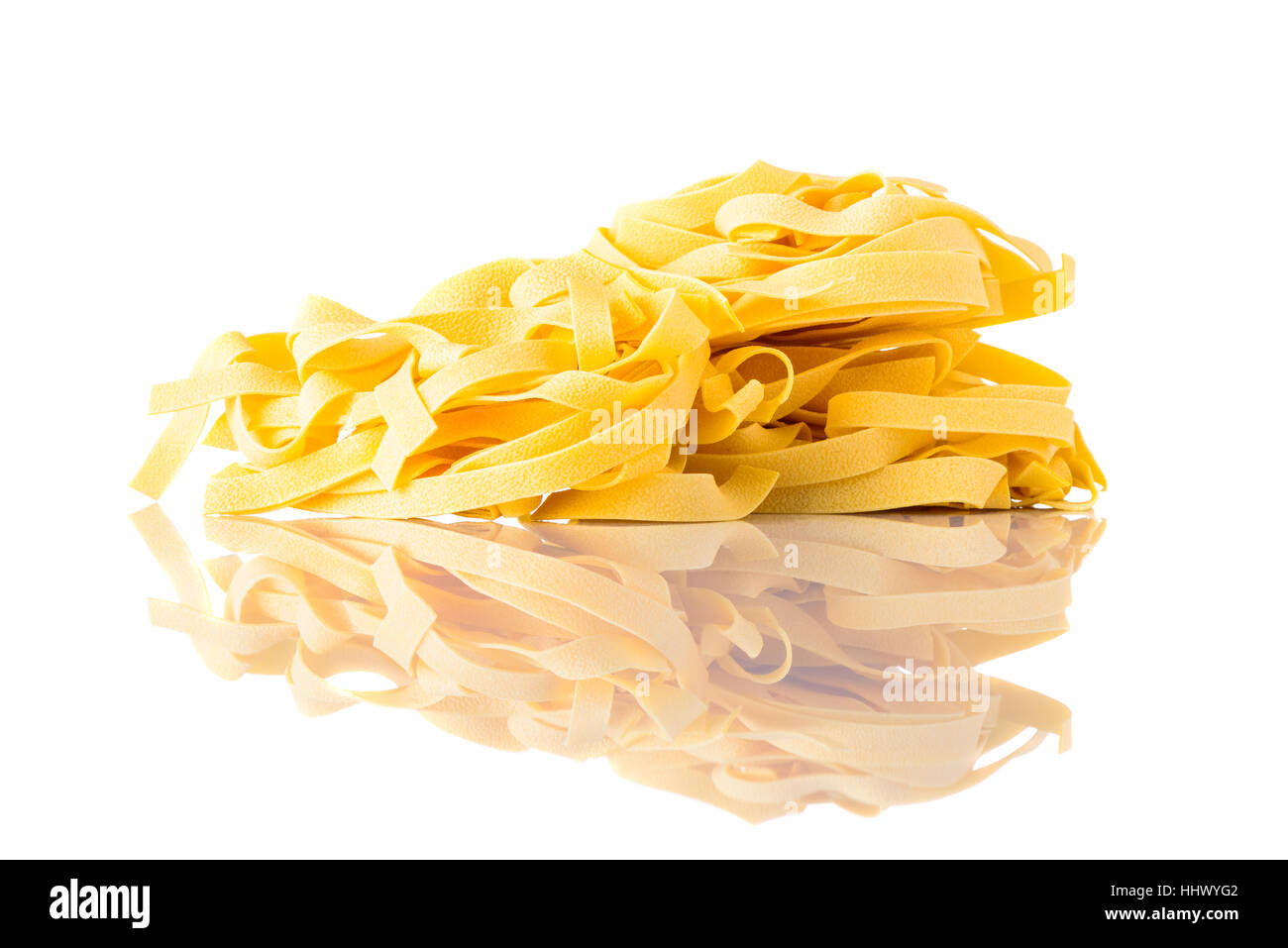 Italian yellow Tagliatelle tagliolini pasta isolated on white ...