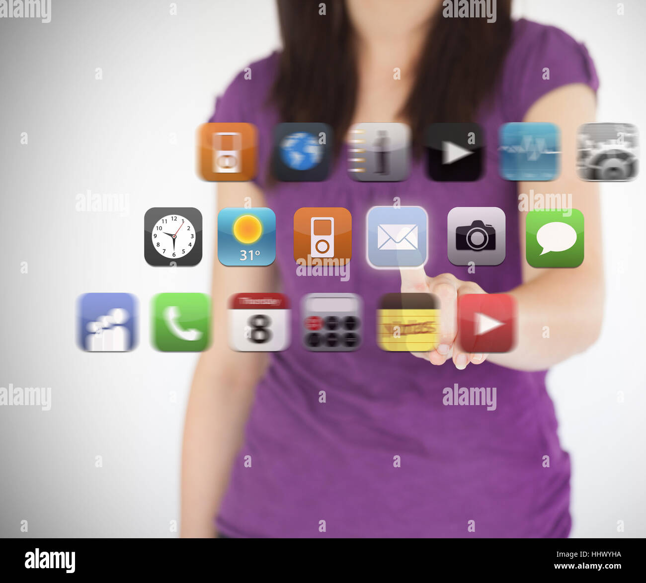 Woman selecting email application from holgraphic touchscreen interface ...