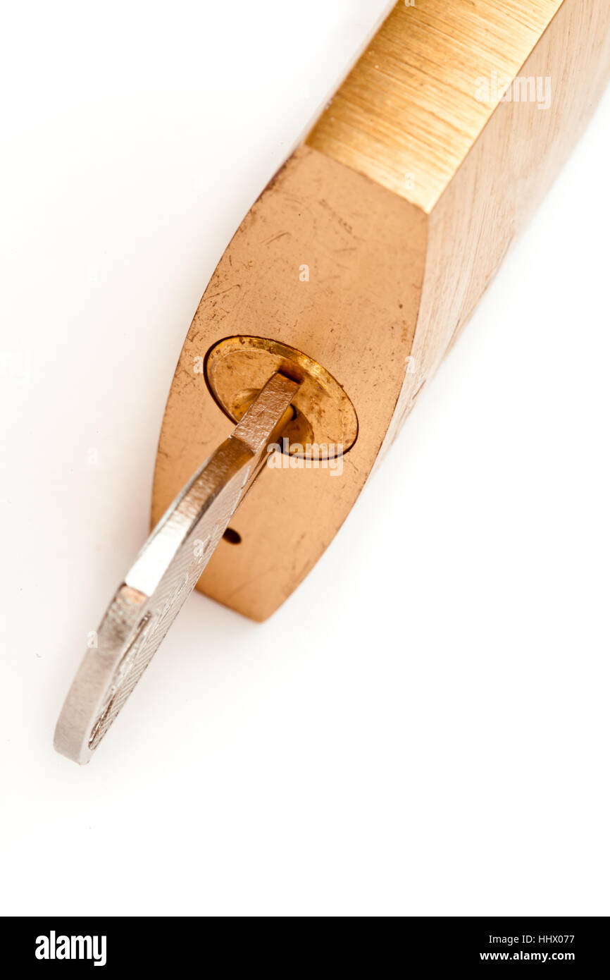 Key locked in padlock against white background Stock Photo - Alamy