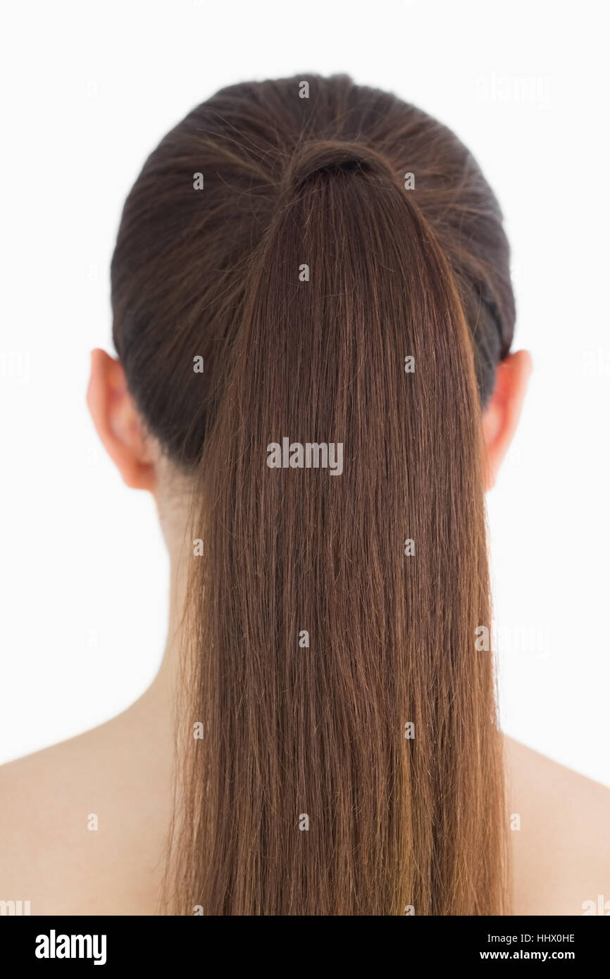 Woman having tied together her long brown hair Stock Photo - Alamy