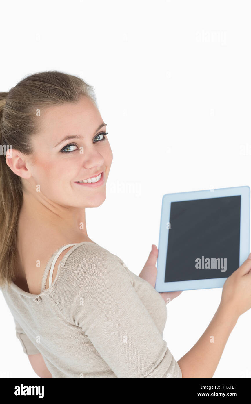 Woman showing a screen tablet in the white background Stock Photo - Alamy