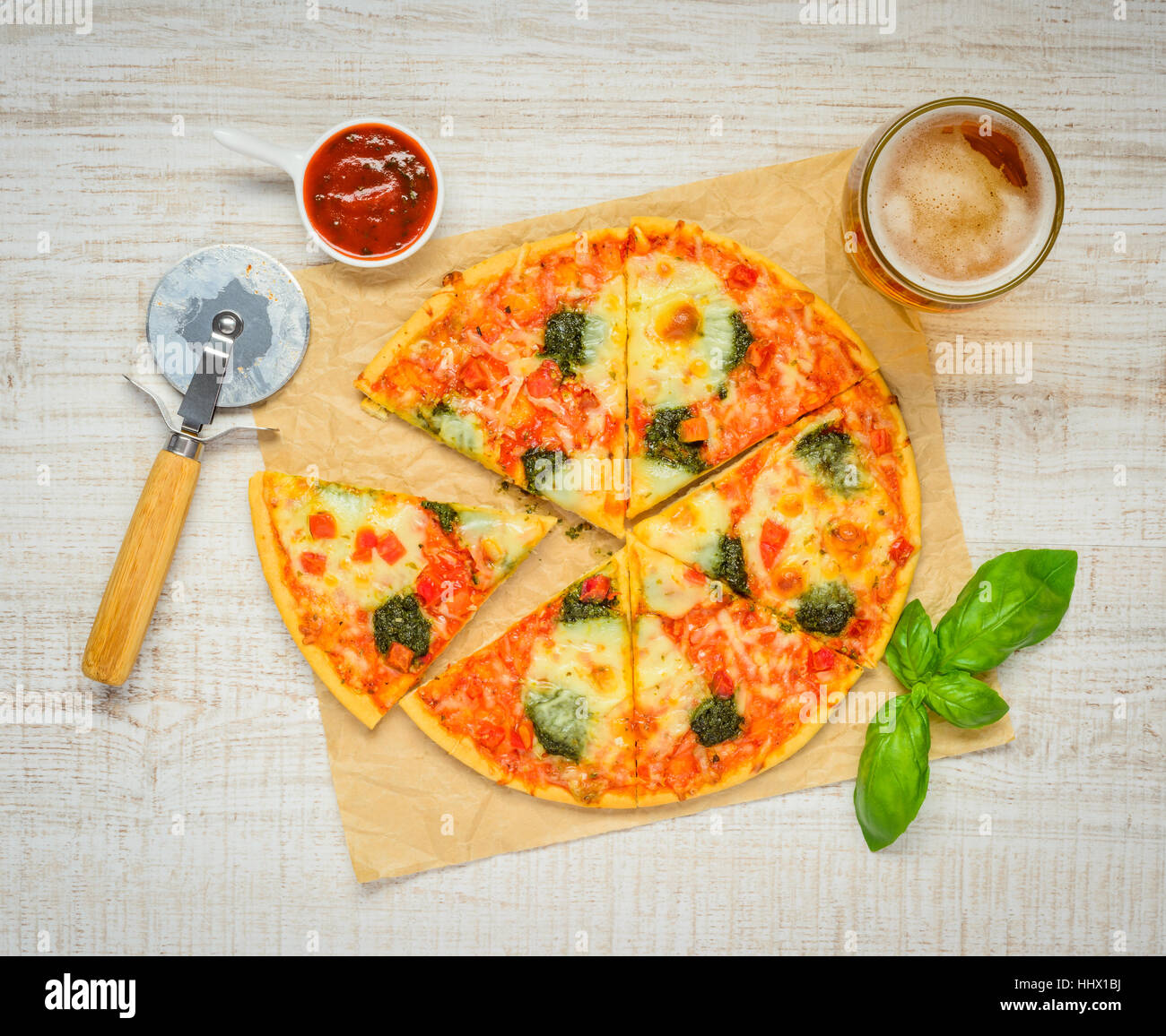 Italian sliced Pizza with Pizza-cutter Wheel and Red Tomato sauce and ...