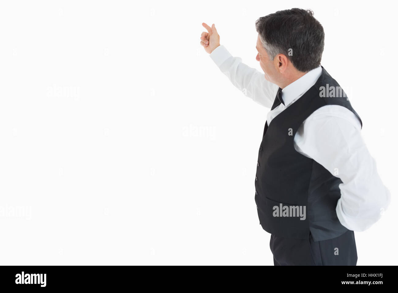 Waiter pointing something in a direction Stock Photo - Alamy