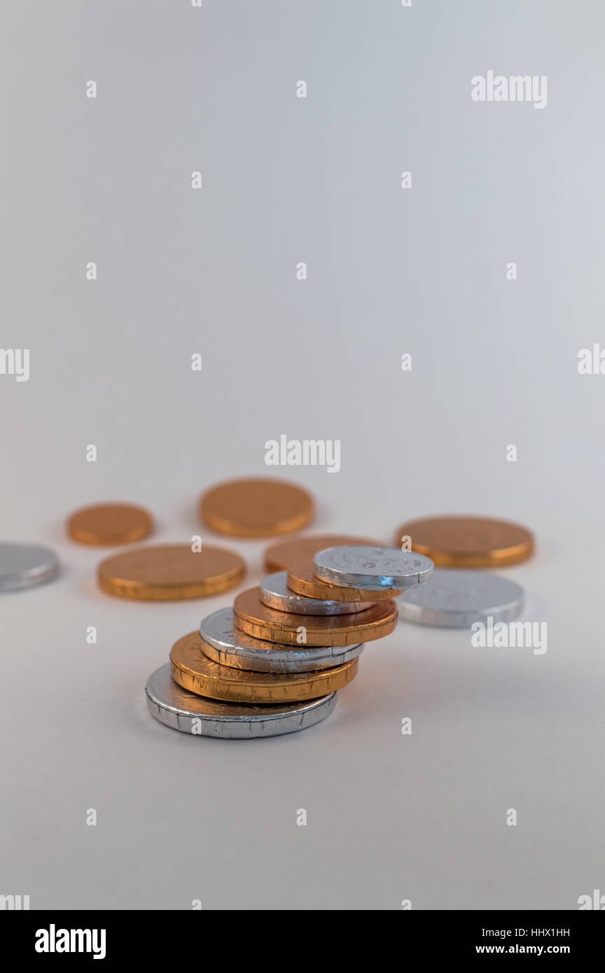 Chocolate money stack in white background Stock Photo - Alamy