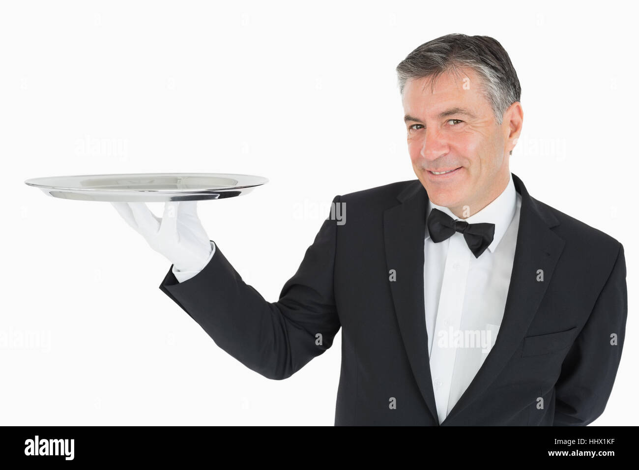 Smiling waiter holding silver hi-res stock photography and images - Alamy