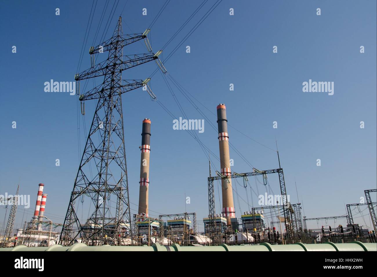 Power plant under clear blue sky Stock Photo - Alamy