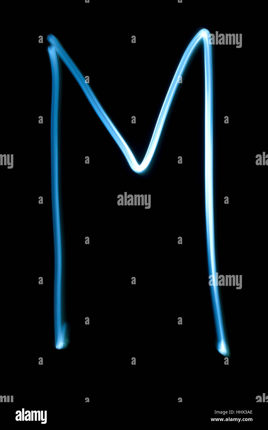 The letter M from natural neon light Stock Photo - Alamy