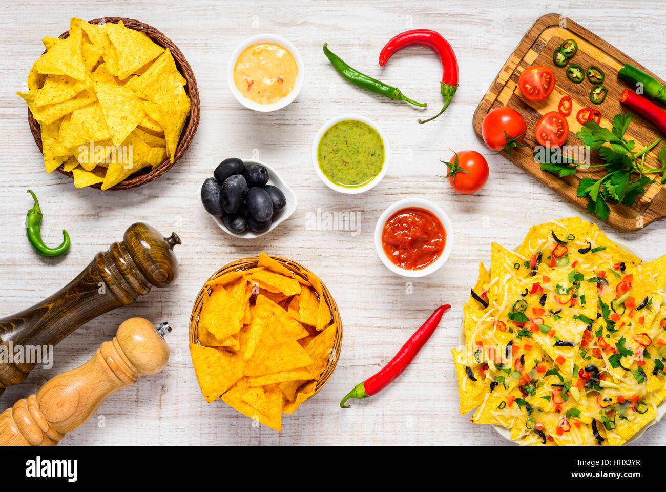Top View of Tortilla Nachos with Condiments, Vegetables and Cooking ...