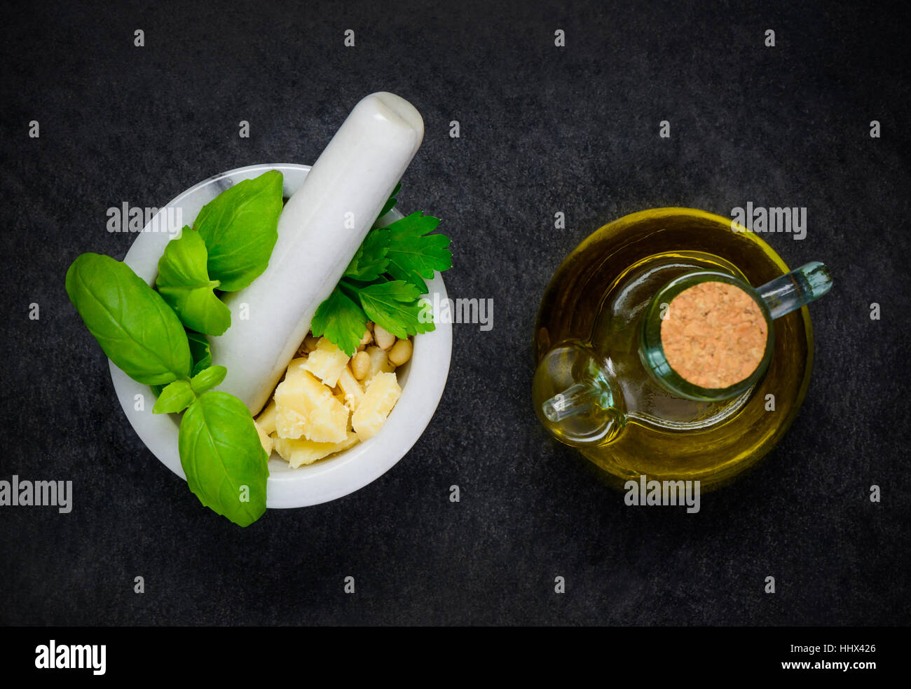 Olive Oil and Pestle with Mortar in Top View Stock Photo - Alamy