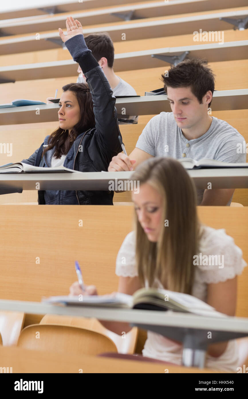 Smart student raising hand question hi-res stock photography and images ...