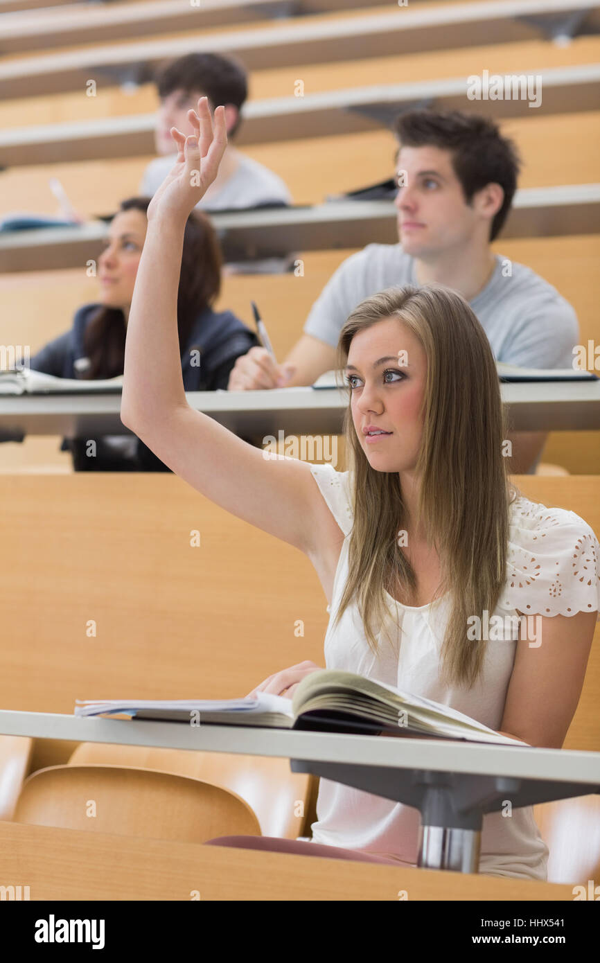 Smart student raising hand question hi-res stock photography and images ...