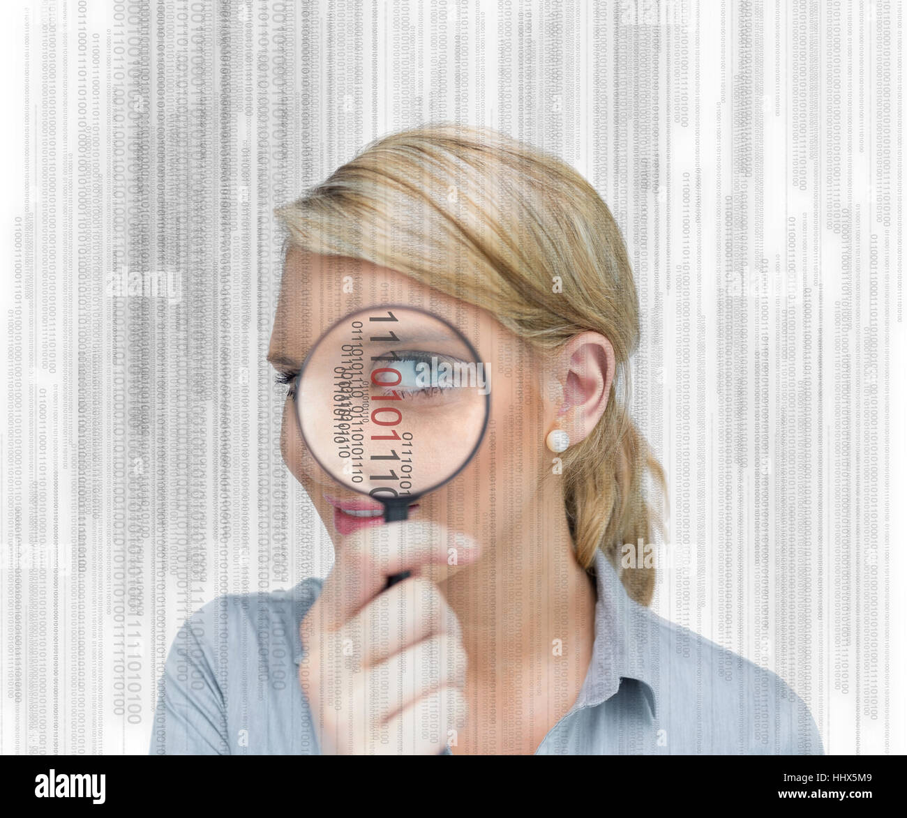 Smiling woman using magnifying glass hi-res stock photography and ...