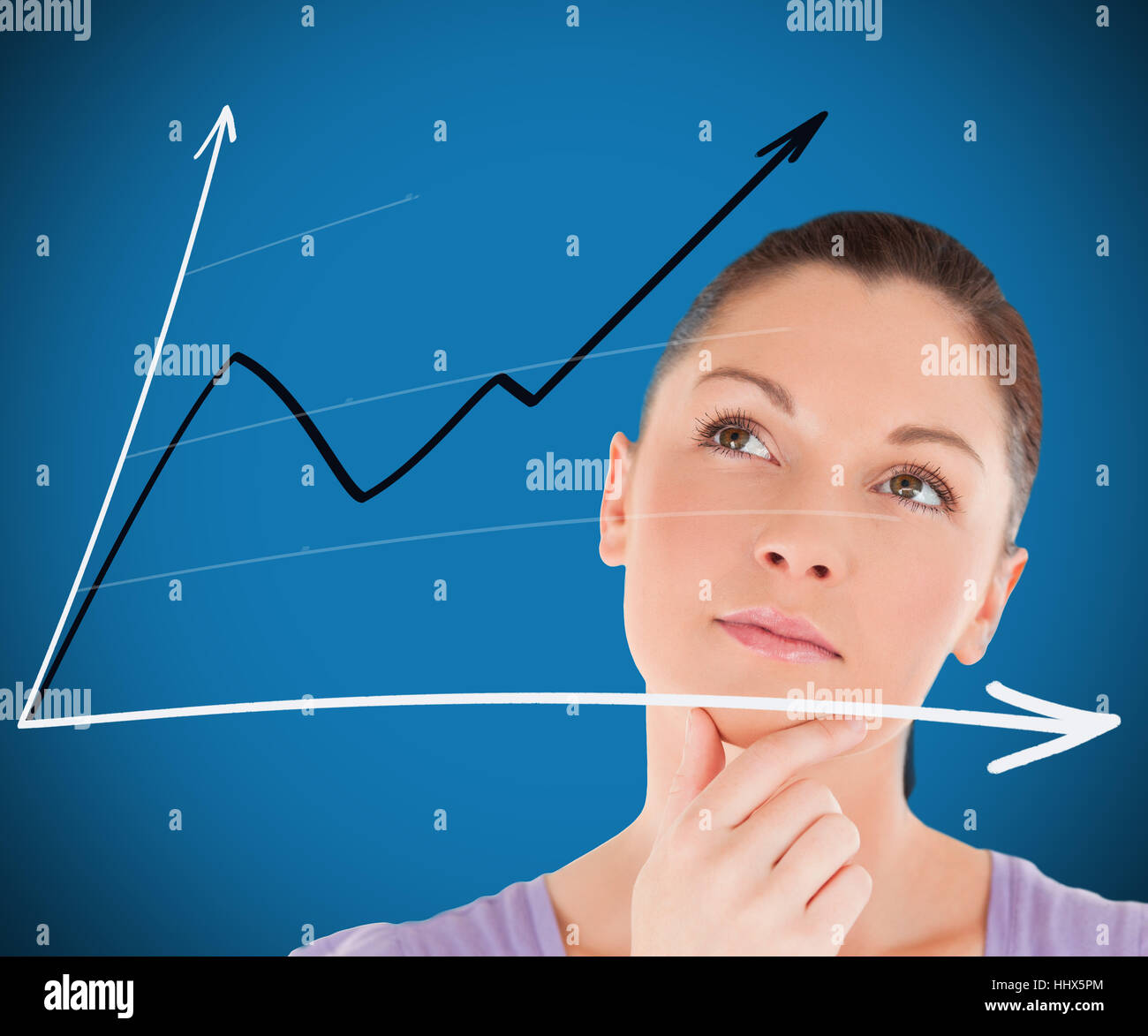 Woman looking at a chart against blue background Stock Photo - Alamy