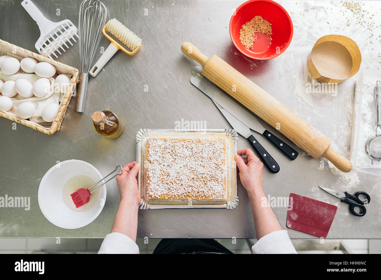 Female pastry chef decorating dessert in the kitchen. Cooking Concept ...