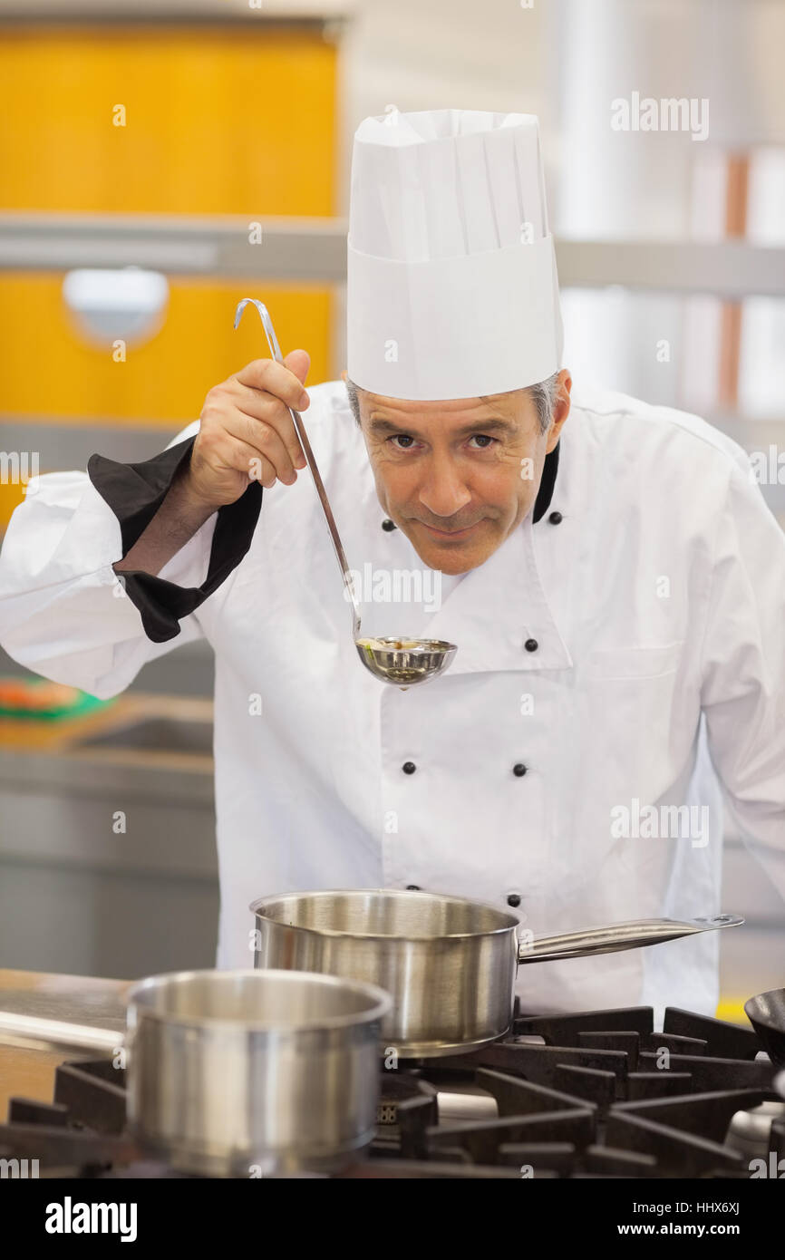 Chef tasting his soup in kitchen Stock Photo - Alamy