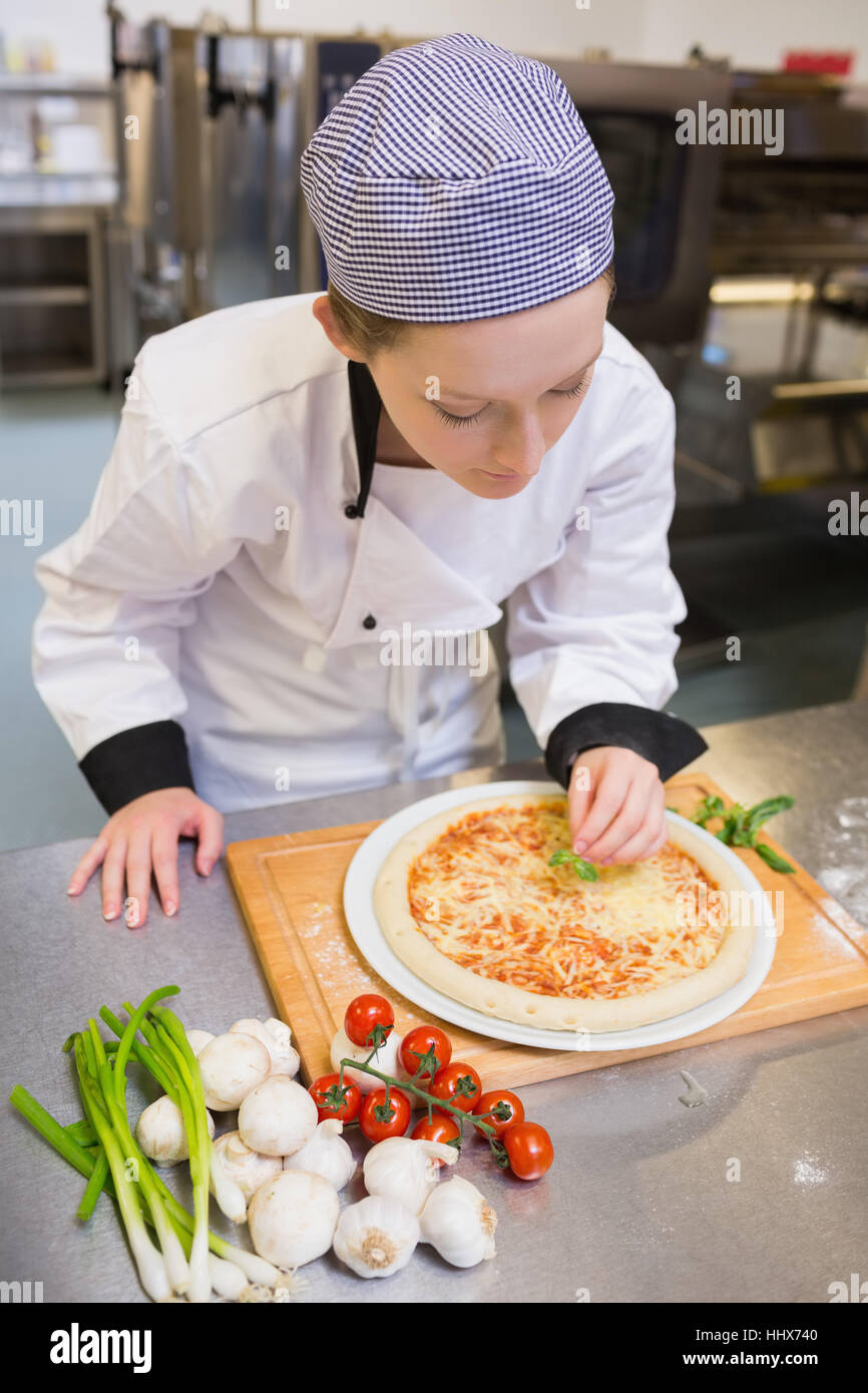 Finishing touch to food pizza hi-res stock photography and images - Alamy