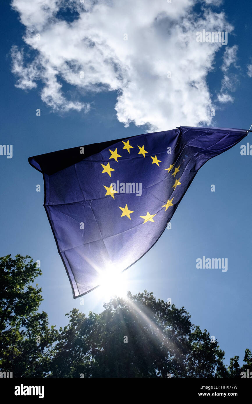 European union flag waving in a sunlit sky Stock Photo - Alamy