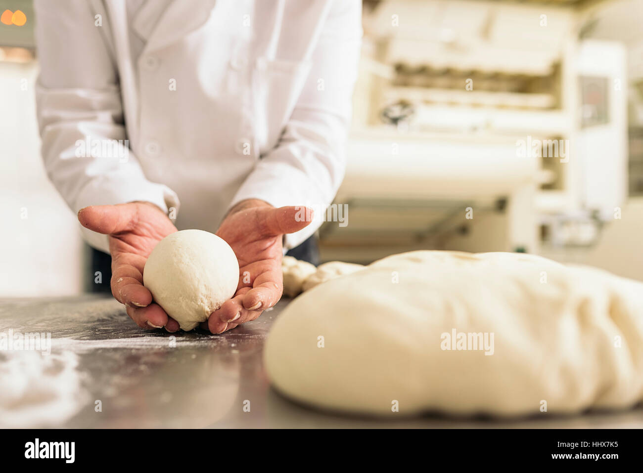Baker kneading dough in a bakery. Bakery Concept Stock Photo - Alamy