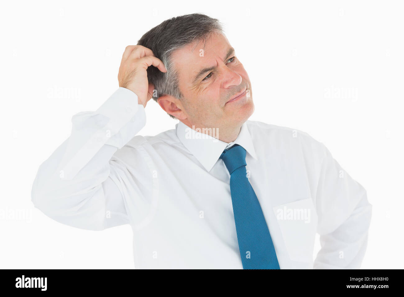 Thinking businessman scratching his head Stock Photo - Alamy
