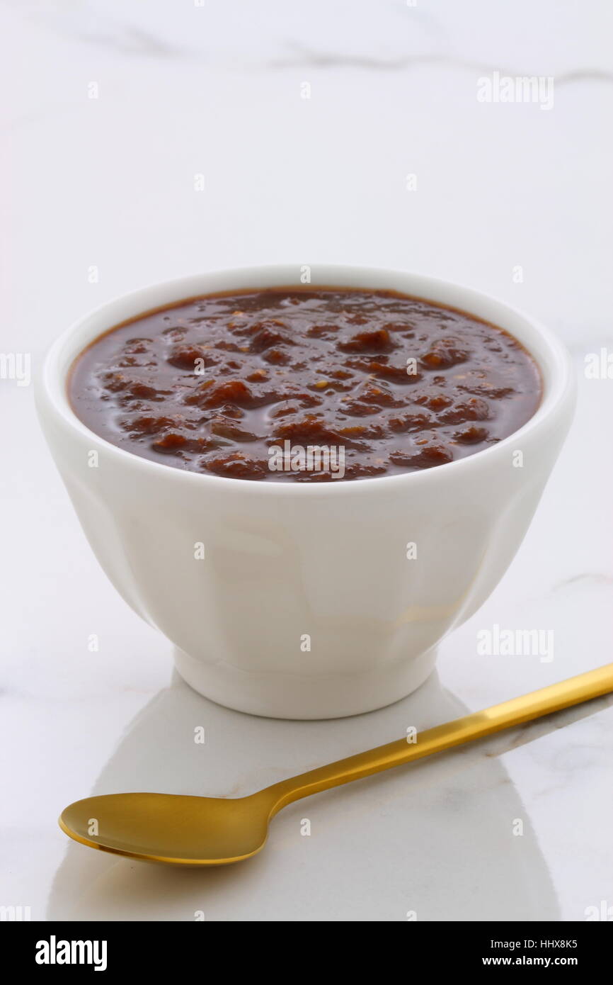 Artisan mexican chipotle sauce on vintage carrara marble table, with a ...