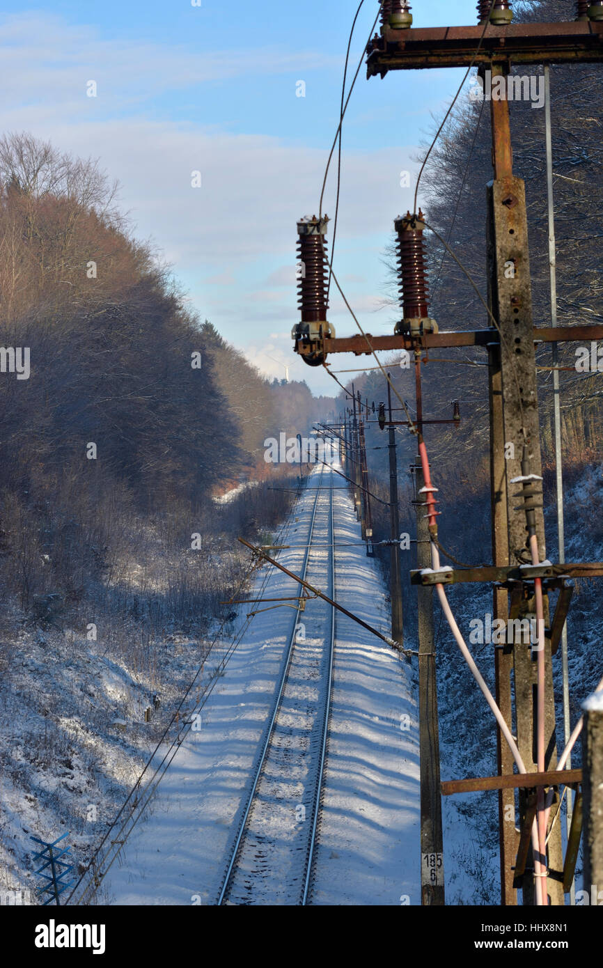train tracks running through the winter forest Stock Photo - Alamy