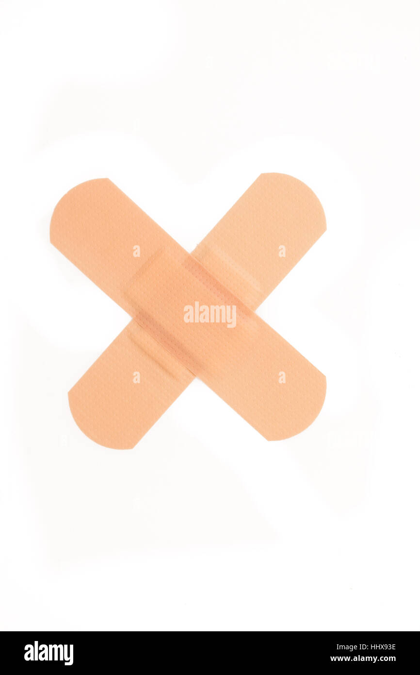 Two plasters crossed on white background Stock Photo - Alamy