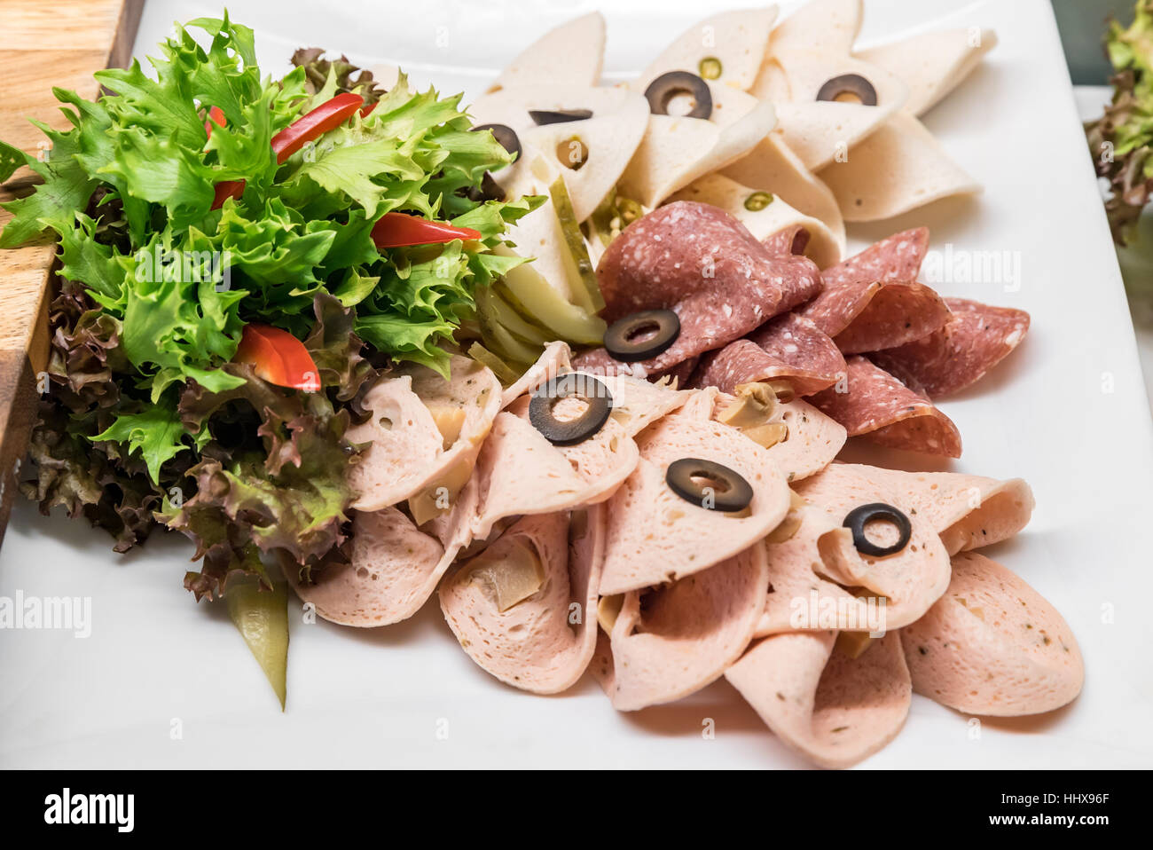 Freshly sliced mixed meat cold cut Stock Photo - Alamy