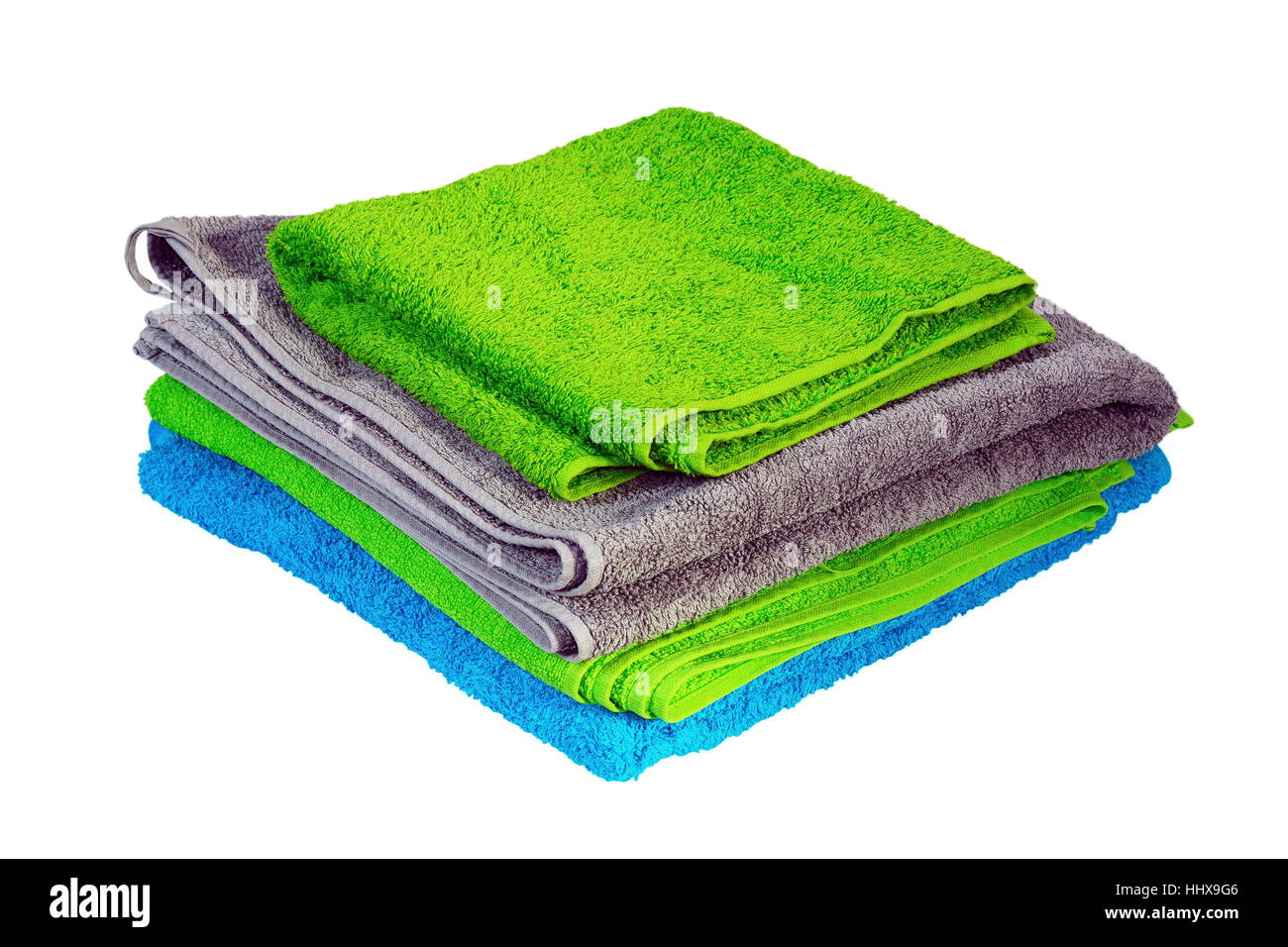 stack of colorful towels isolated over white background ( green, blue ...