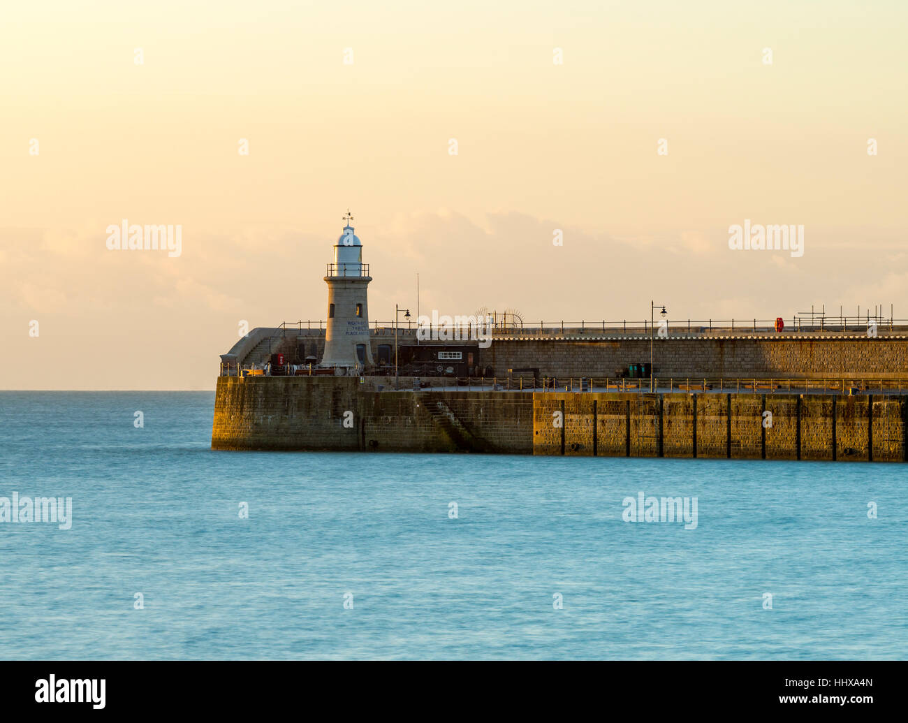 Folkestone lighthouse and harbour arm at sunrise, Kent Stock Photo - Alamy