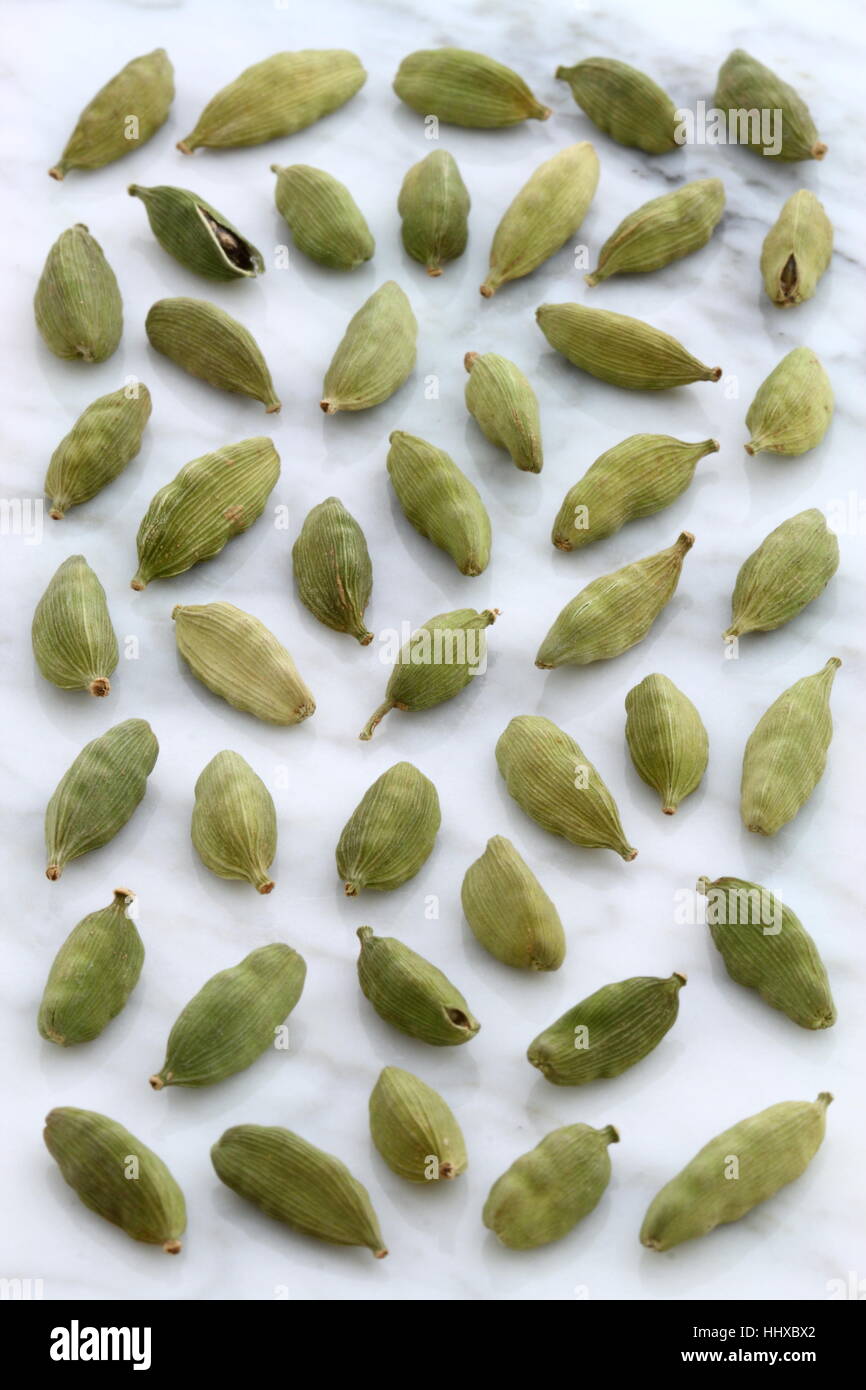 beautiful cardamom pods, on top of carrara marble coutertop Stock Photo ...