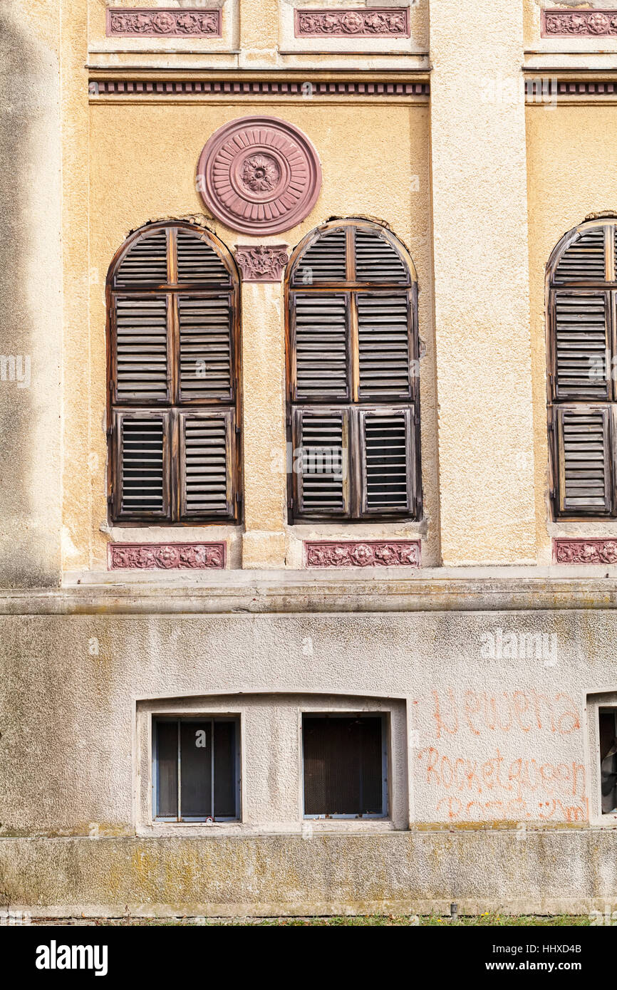 old wooden blinds on the windows Stock Photo - Alamy