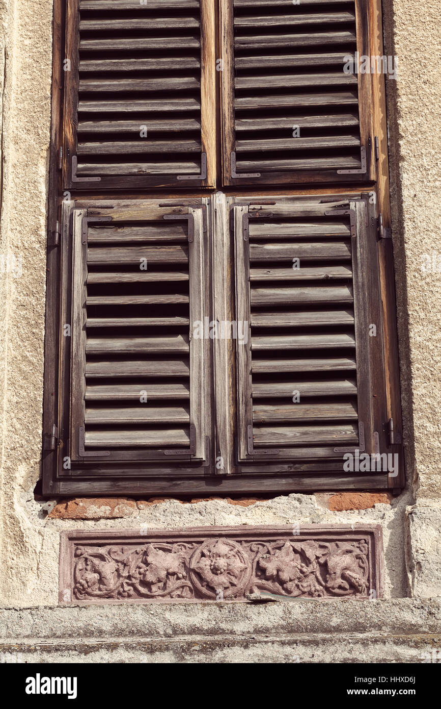 old wooden blinds on the windows Stock Photo - Alamy