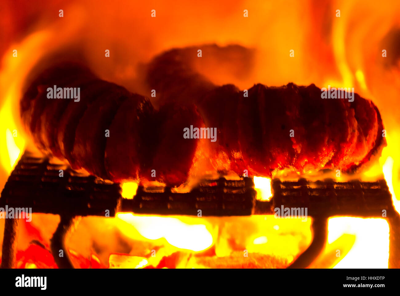 Sausages in burning flame Stock Photo - Alamy