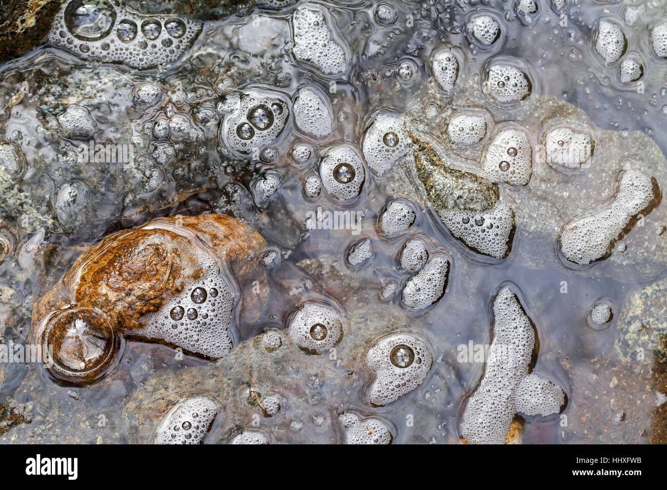 stone under the sparkling mountain water, note shallow depth of field ...