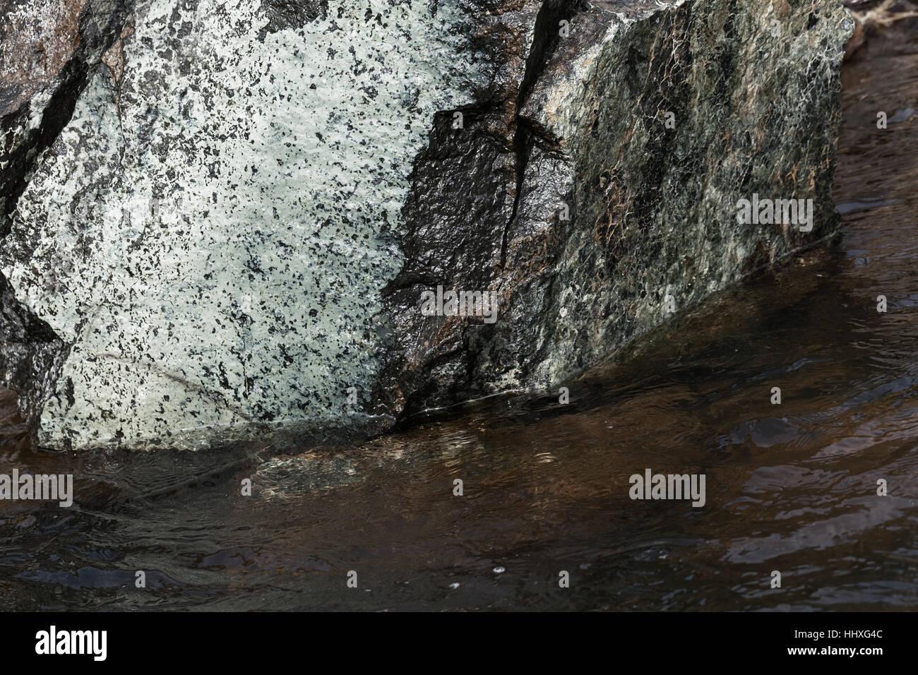 stone under the mountain water, note shallow depth of field Stock Photo ...