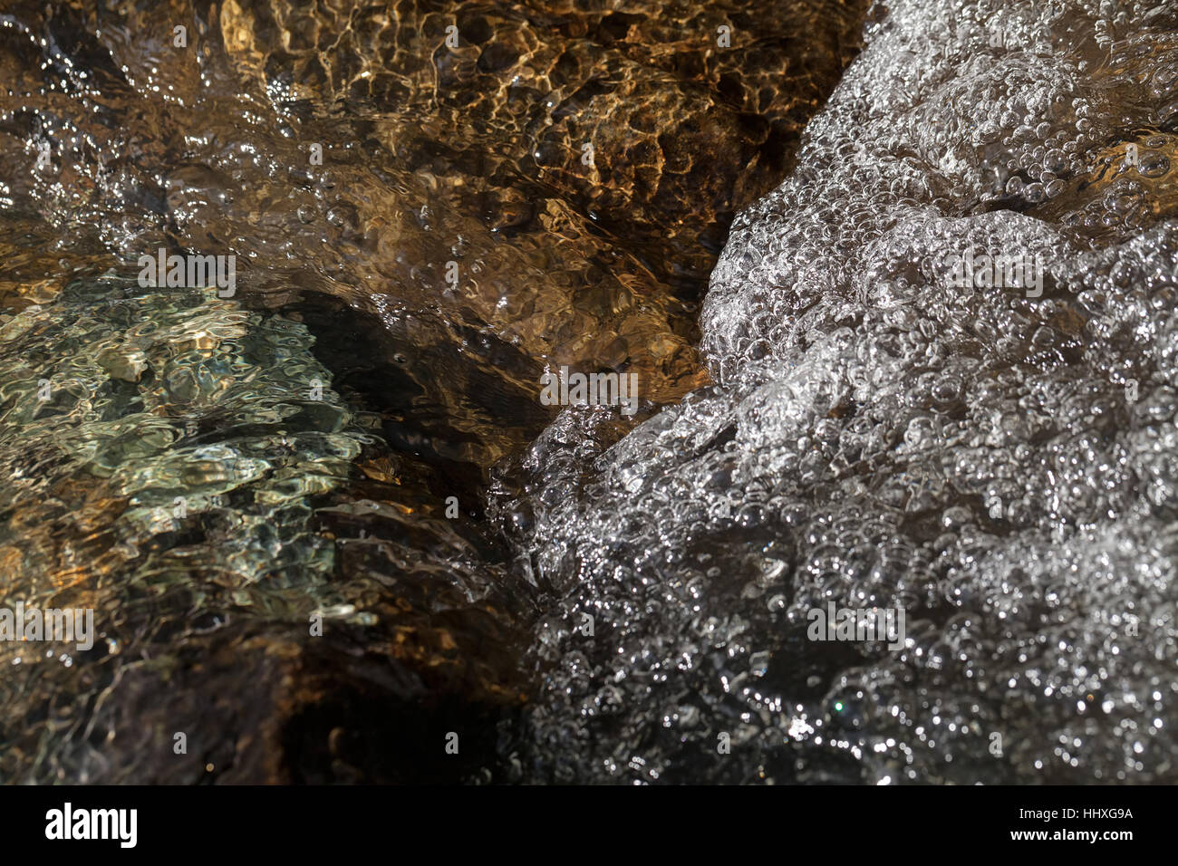 stone under the mountain water, note shallow depth of field Stock Photo ...