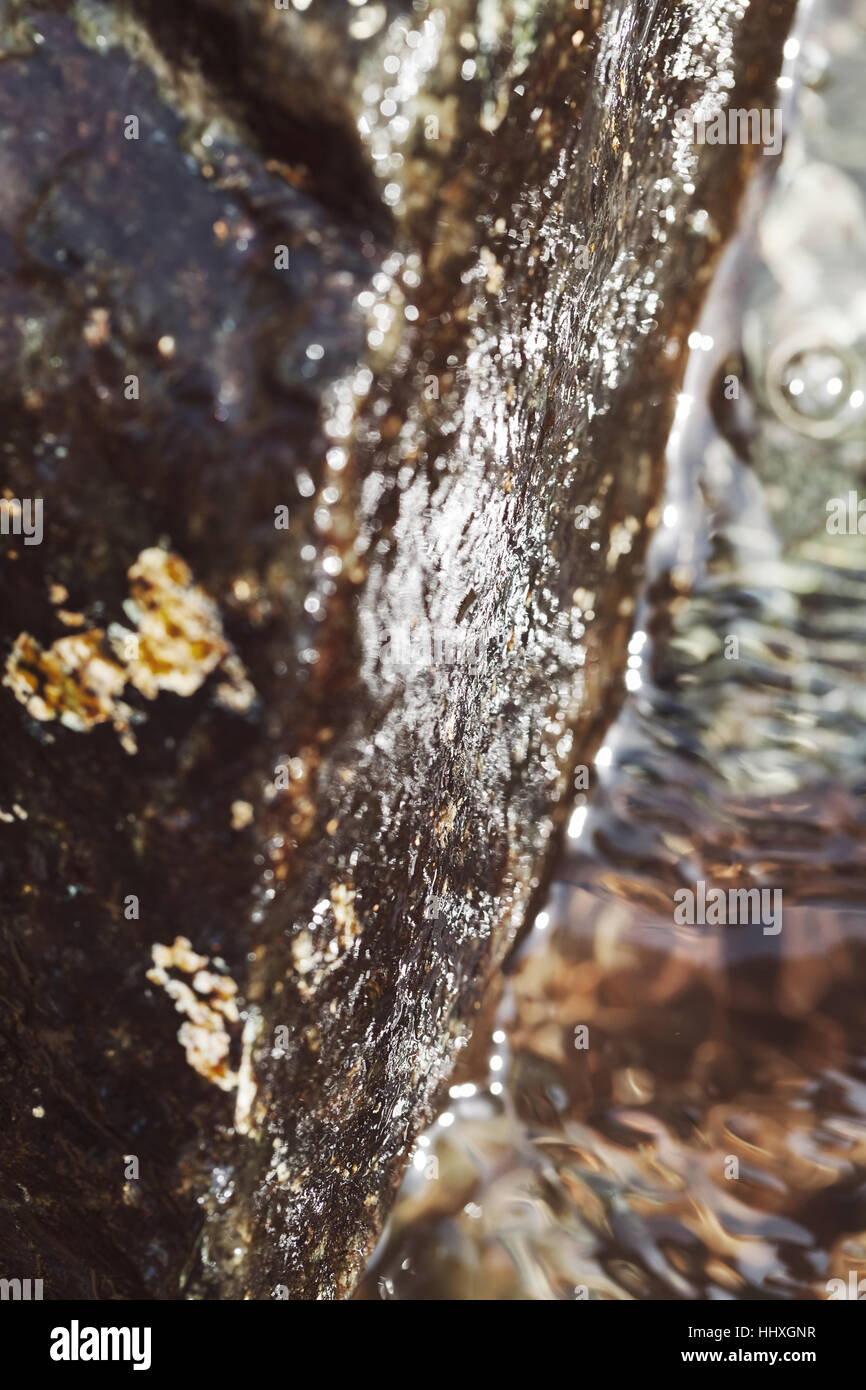stone under the mountain water, note shallow depth of field Stock Photo ...