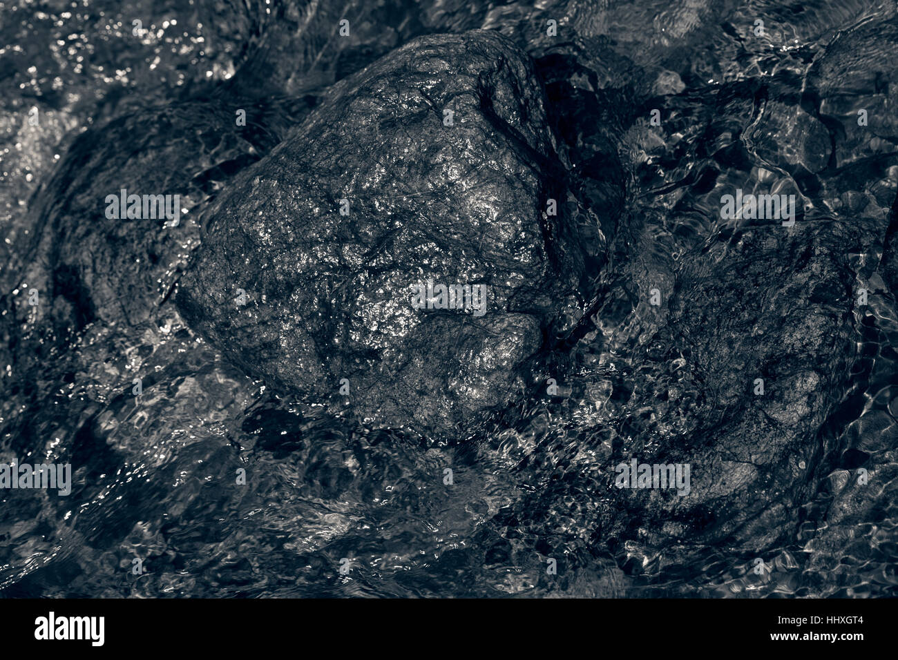 stone under the mountain water, note shallow depth of field Stock Photo ...