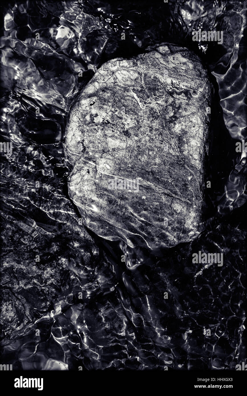 stone under the mountain water, note shallow depth of field Stock Photo ...