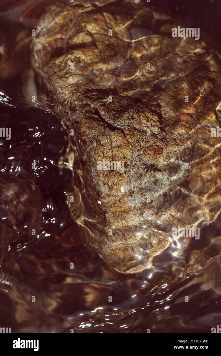 stone under the mountain water, note shallow depth of field Stock Photo ...