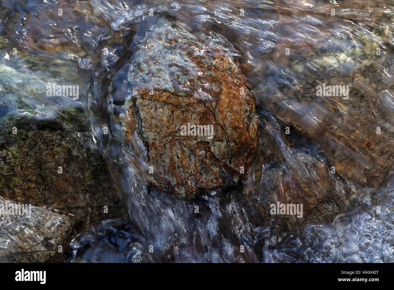 stone under the mountain water, note shallow depth of field Stock Photo ...