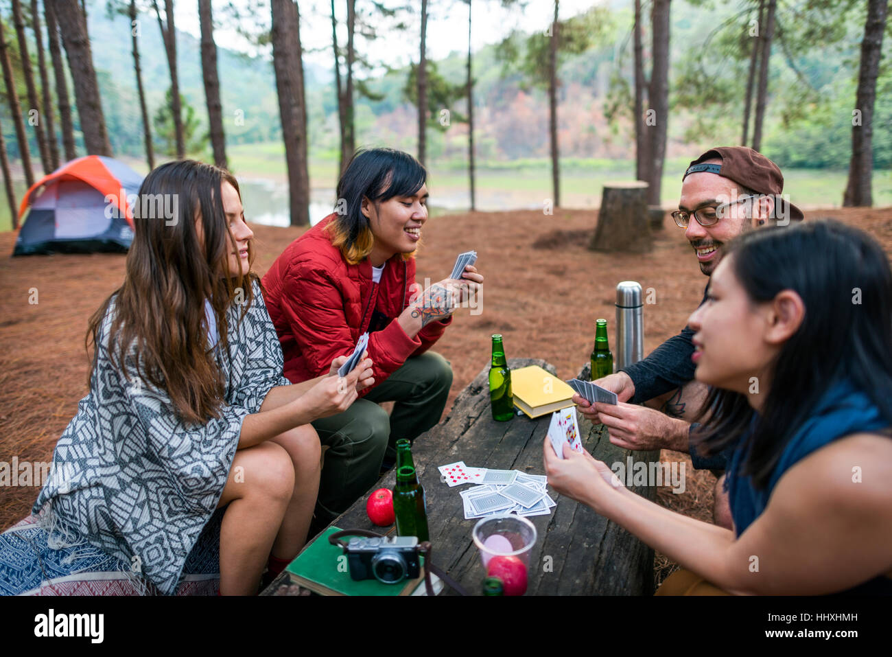 Friends Camping Playing Cards Concept Stock Photo - Alamy