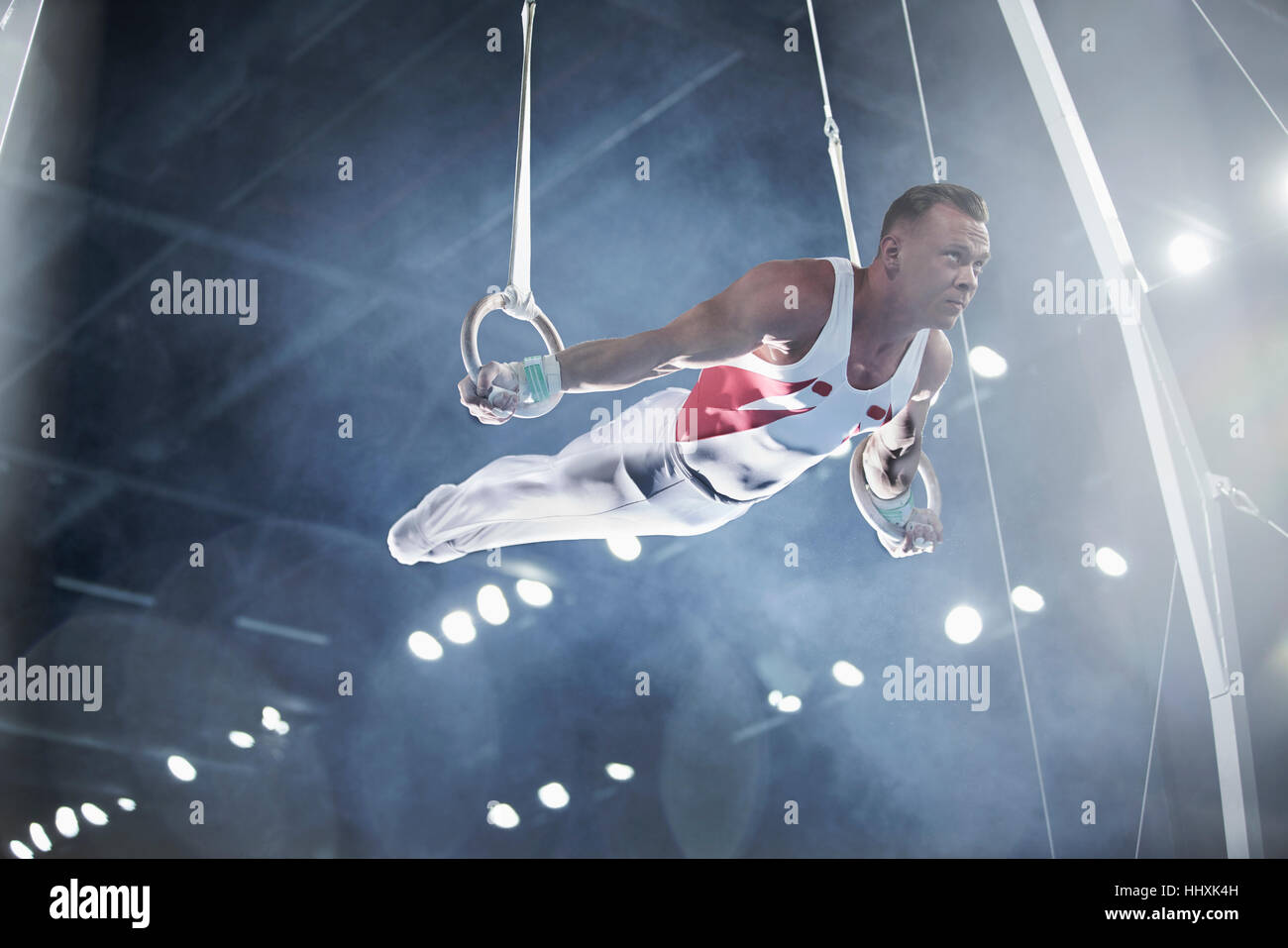 Male gymnast on rings hi-res stock photography and images - Alamy