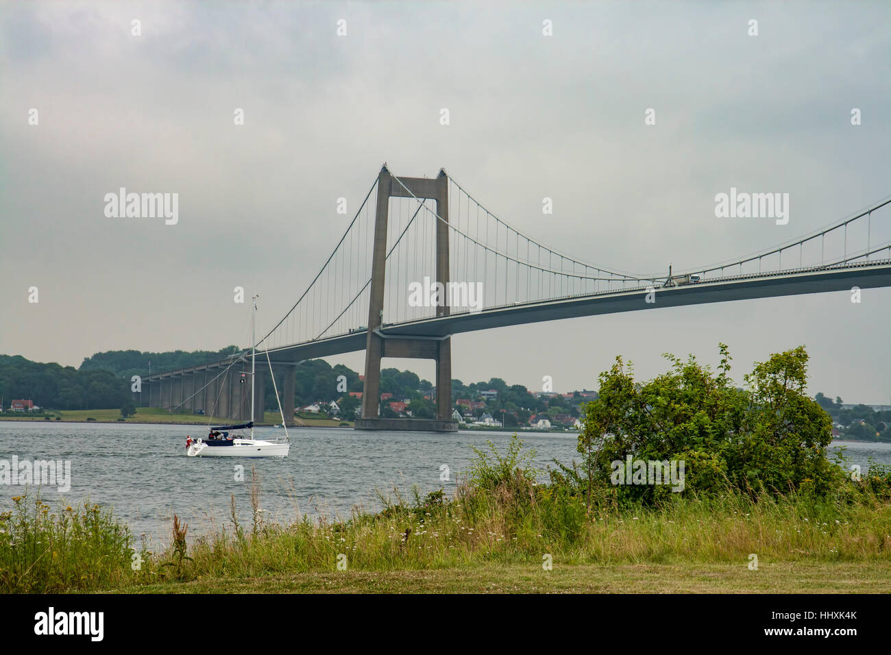 Sailboat passing a bridge at Fyen, Denmark Stock Photo - Alamy